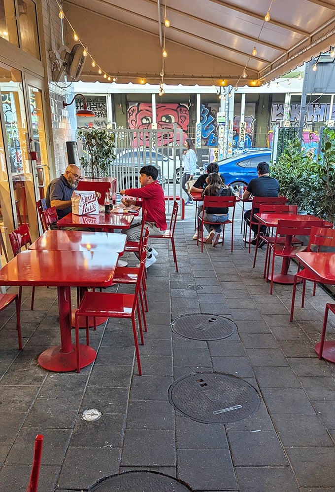 The outdoor seating area—where Miami's vibrant street life provides the entertainment while you focus on burger bliss.