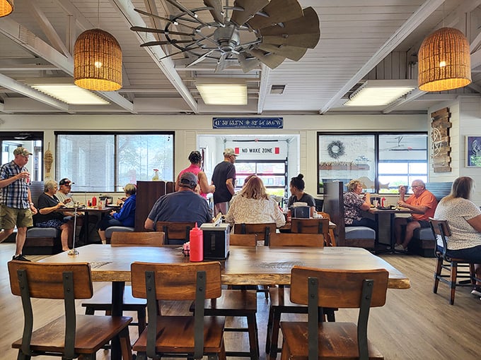 Where locals gather to break bread and swap fish tales. That "No Wake Zone" sign isn't just decoration—it's dining philosophy at its finest.