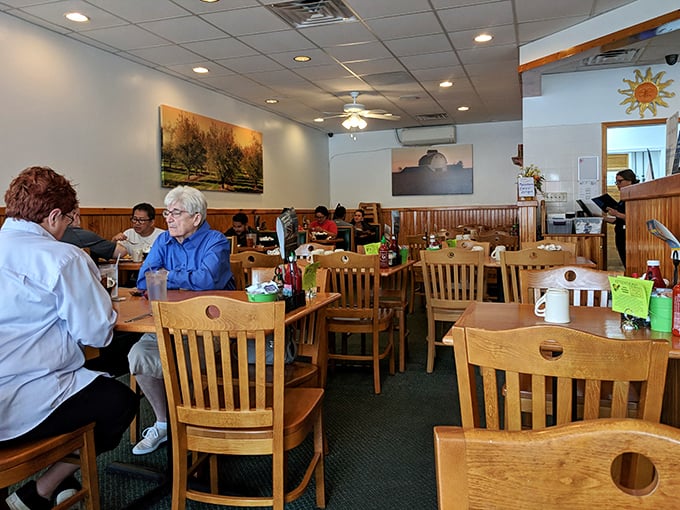 The dining room hums with happy conversations and the clinking of satisfied forks—this is breakfast democracy in action, folks.