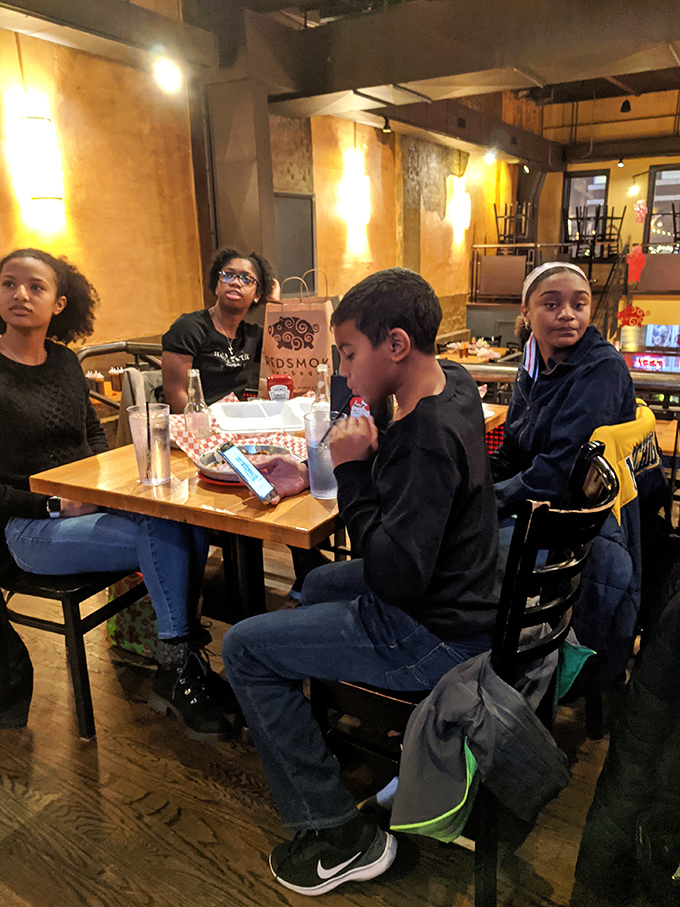 Family dinners at Redsmoke prove BBQ brings people together better than any social media platform ever could – just leave your diet at the door.