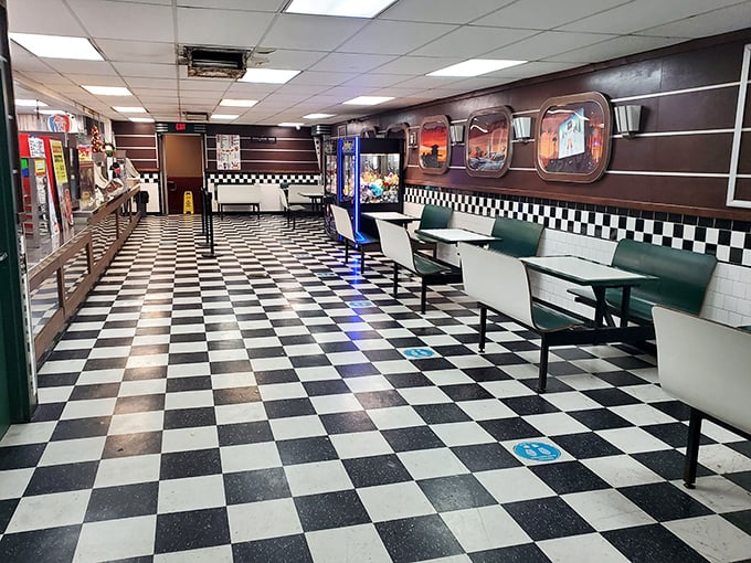 Black and white checkerboard floors transport you to simpler times—this isn't just dining, it's a portal to 1950s Americana.