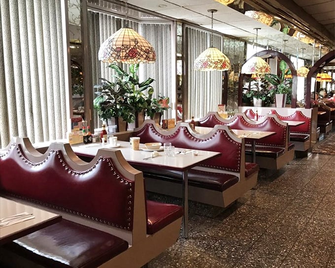 These booths aren't just seating—they're front-row tickets to the greatest show on earth: American diner culture, complete with Tiffany-style lamps.