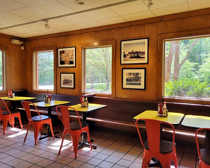 Wood-paneled walls adorned with history and orange chairs that say, "Stay awhile, the food's worth it."