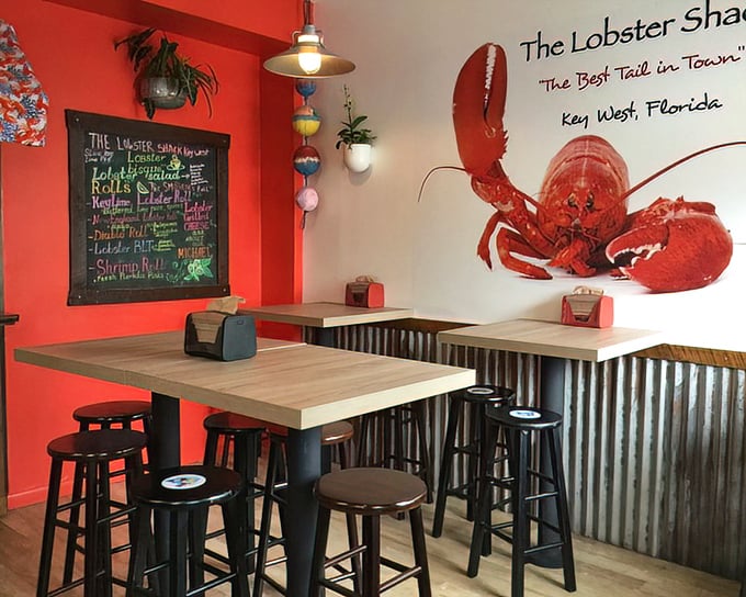 The dining area feels like eating in your coolest friend's kitchen—if your friend had a giant lobster mural and industrial-chic sensibilities.