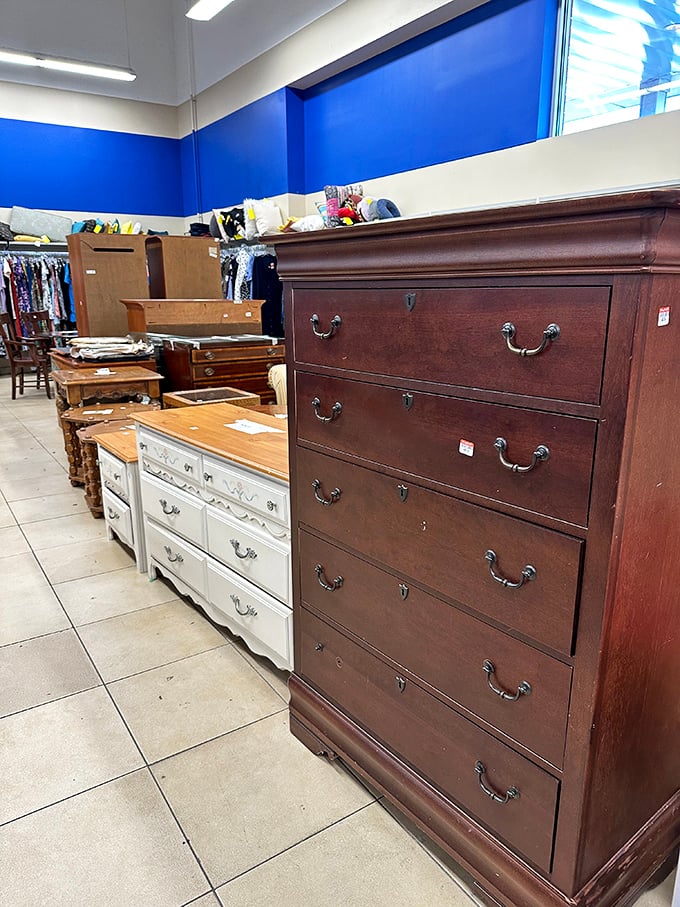 The furniture section, where solid wood dressers from another era stand proudly, whispering tales of the bedrooms they once adorned.
