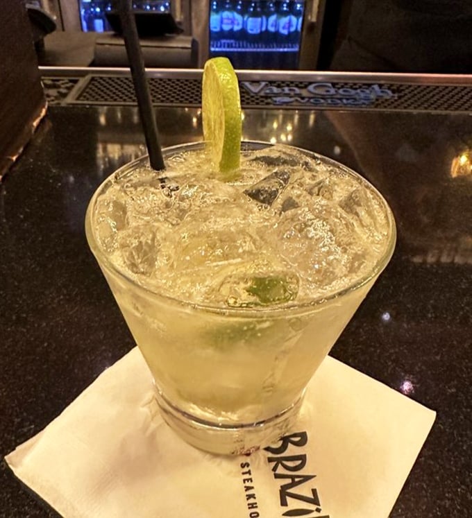 The caipirinha—Brazil's national cocktail—sits innocently in its glass, ready to convince you that lime and sugar were made for each other.