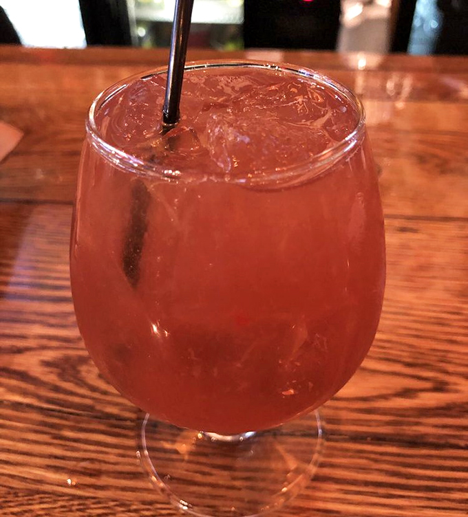This isn't just a cocktail—it's liquid amber catching the light like a sunset in a glass. The kind of drink that makes conversation flow easier.