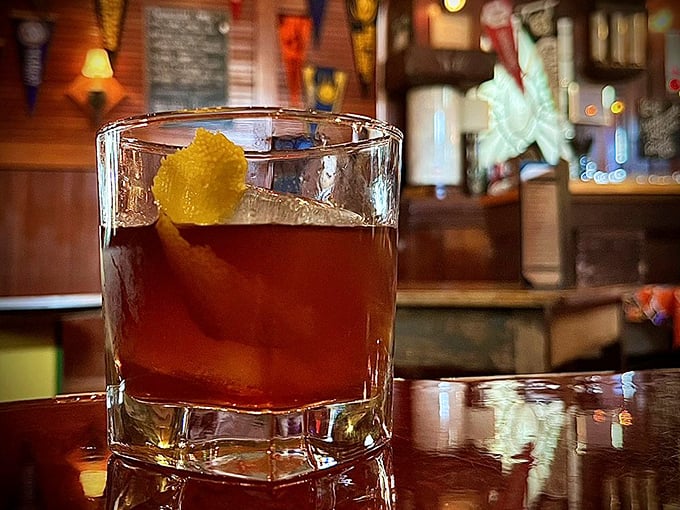 An old fashioned sitting on the bar like liquid amber—proof that sometimes the classics endure because they're simply perfect as they are.