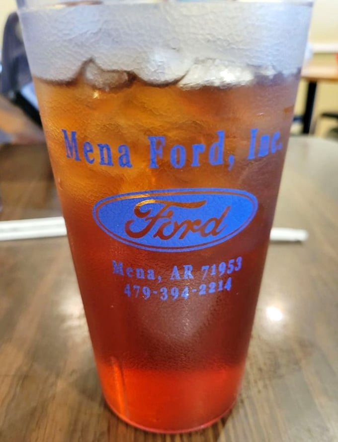 Even the sweet tea comes with local pride, served in glasses that have probably witnessed more town gossip than the local barber shop.