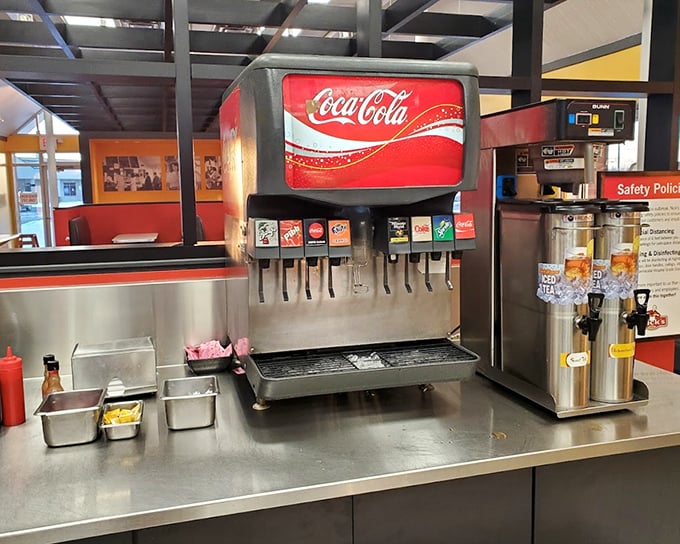 The soda fountain—where diet plans go to die and childhood memories come flooding back with every fizzy sip.