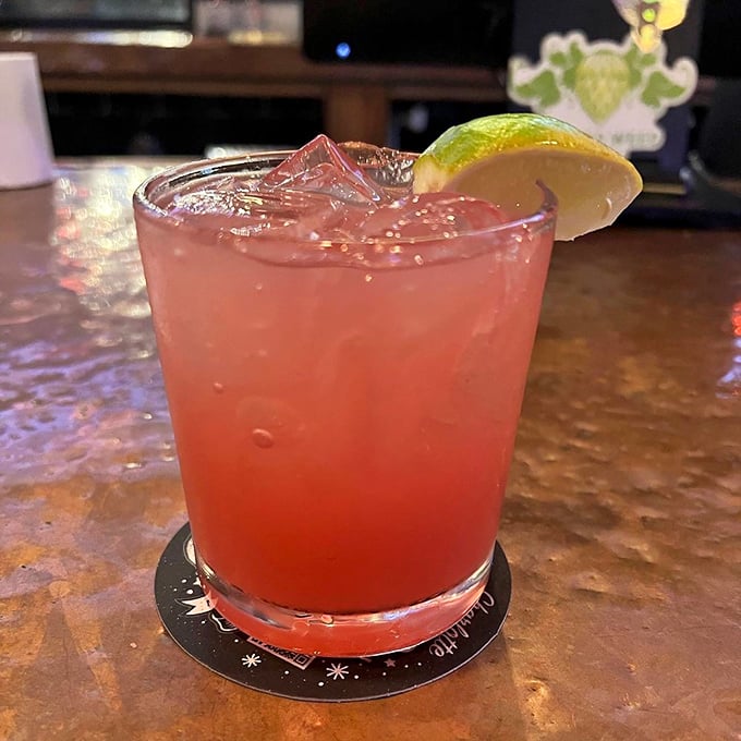 That vibrant cocktail isn't just Instagram-worthy; it's a refreshing counterpoint to burger indulgence that deserves its own moment of fame.