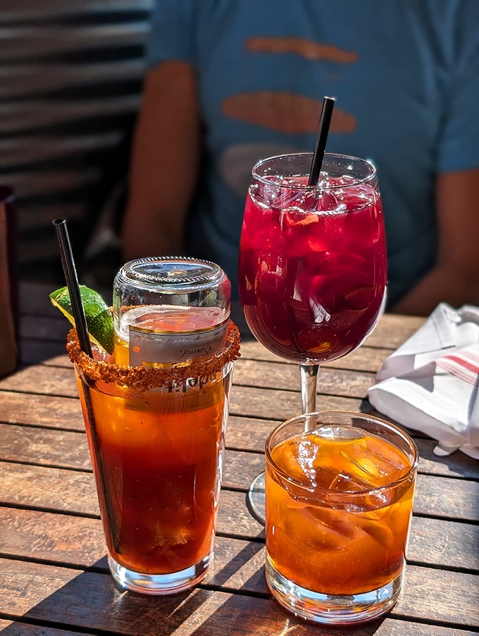 Cocktails that don't just complement seafood—they compete for your attention with vibrant colors and garnishes that practically demand a selfie.