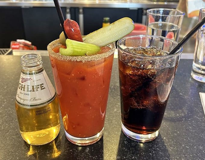 The holy trinity of beverages: beer for courage, Bloody Mary for recovery, and soda because sometimes you need to pace yourself. Hydration with options.