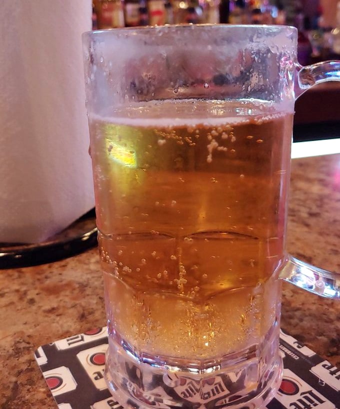 Cold beer in a frosty mug—the universal language of "relax, you've arrived." The perfect companion to cut through rich barbecue flavors.