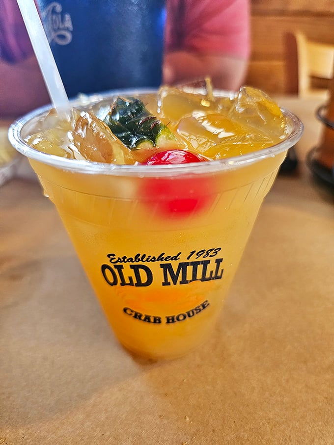 A fruity concoction in a souvenir cup—because sometimes the perfect accompaniment to seafood is something sweet, cold, and just a little bit festive.