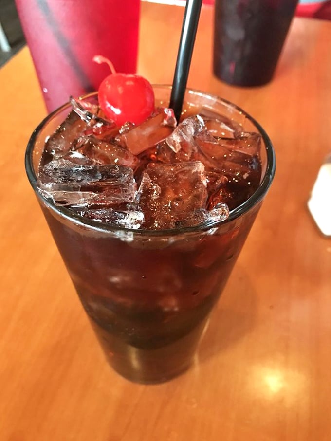 That cherry-topped drink isn't just a beverage—it's a commitment to treating yourself right. Tuesday suddenly feels like Friday night.