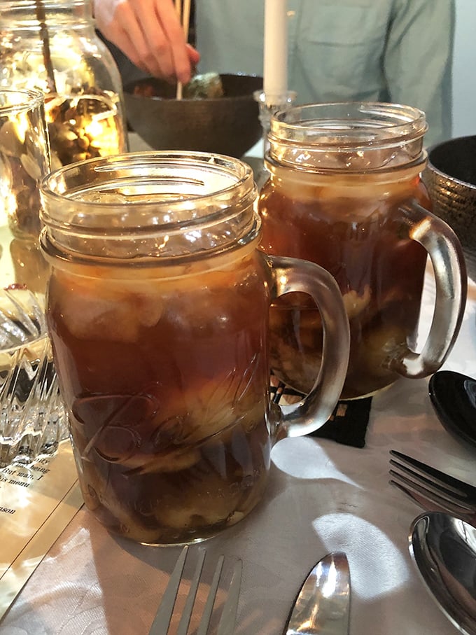 Sweet tea served in Mason jars—because in the South, proper hydration is as much about tradition as it is about quenching thirst.