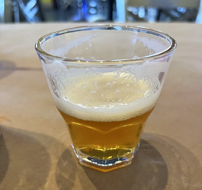 A cold beer in a proper glass – because sometimes the perfect seafood sidekick isn't another seafood, but a golden, frothy companion.