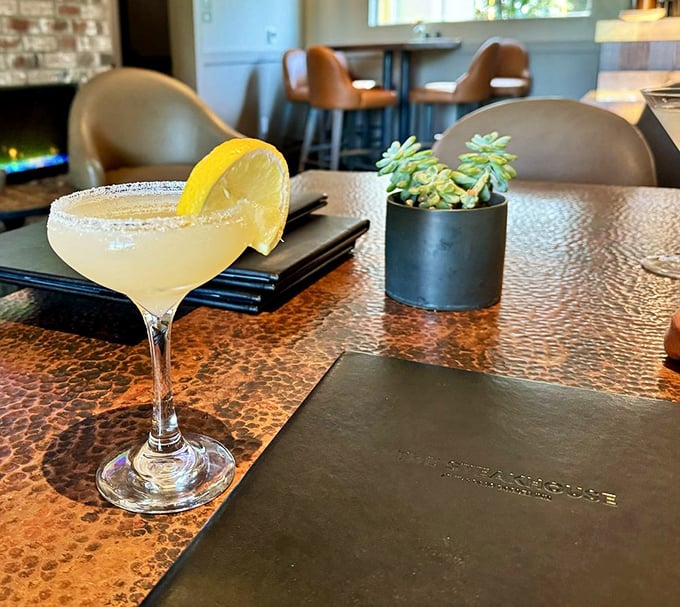 A classic margarita with salt rim awaits on the copper-topped table – the perfect prelude to a serious steak session.