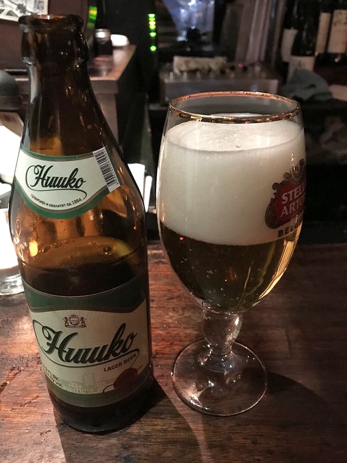 Nothing complements Serbian cuisine quite like a cold Nikšićko beer, its crisp flavor cutting through the richness of the hearty dishes.