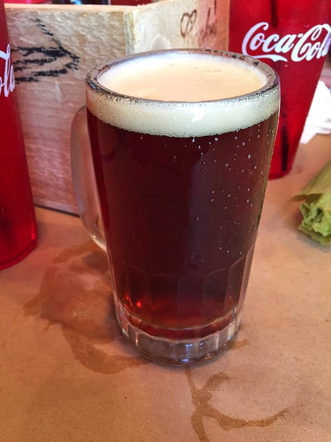 A perfectly poured dark beer—because cracking crabs is thirsty work that deserves a proper reward.
