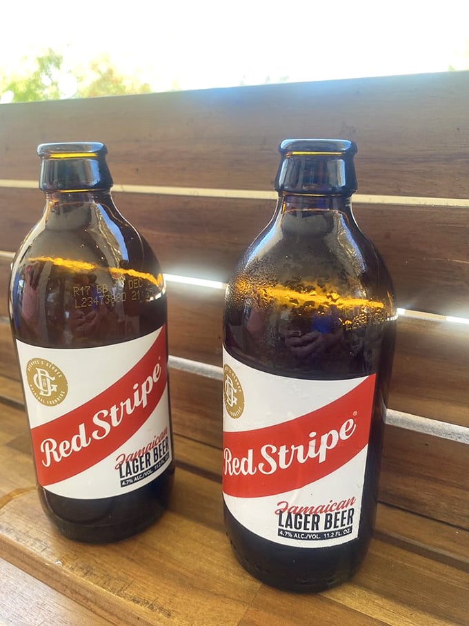 Nothing complements fresh seafood quite like cold Red Stripes—these bottles are sweating almost as much as I am in Florida's humidity.