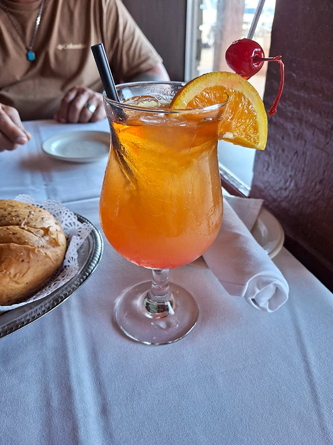 A cocktail this photogenic deserves its own Instagram account. That cherry and orange slice aren't garnishes—they're the jewelry this drink deserves.