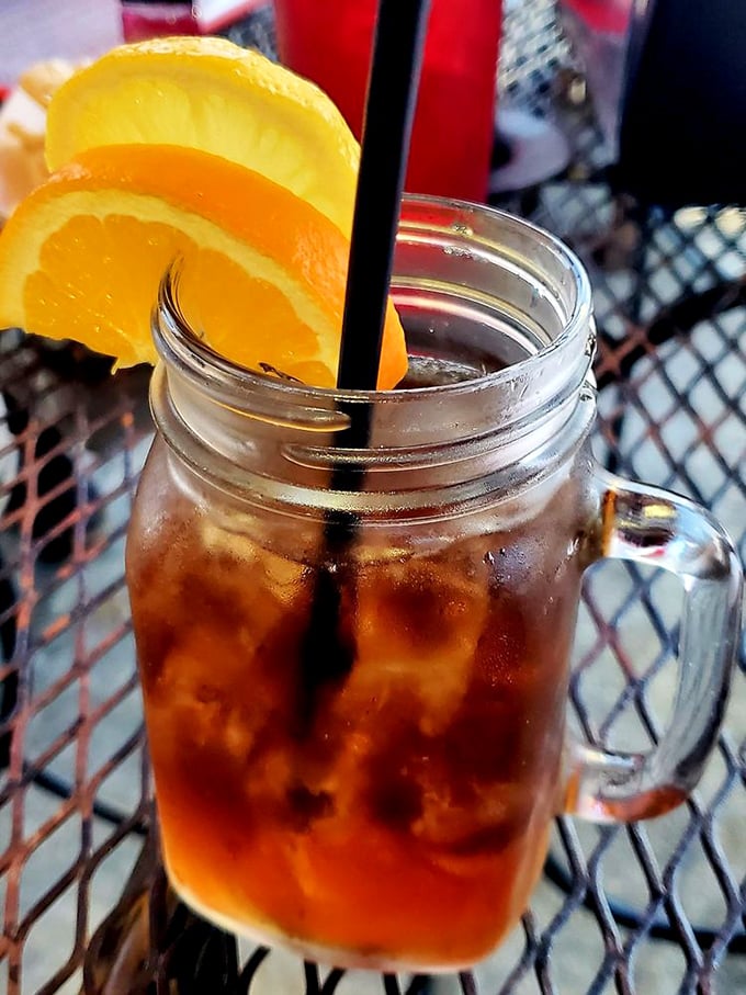 Sweet tea served in a mason jar with citrus garnish—the unofficial champagne of the South and perfect companion to spicy Cajun flavors.