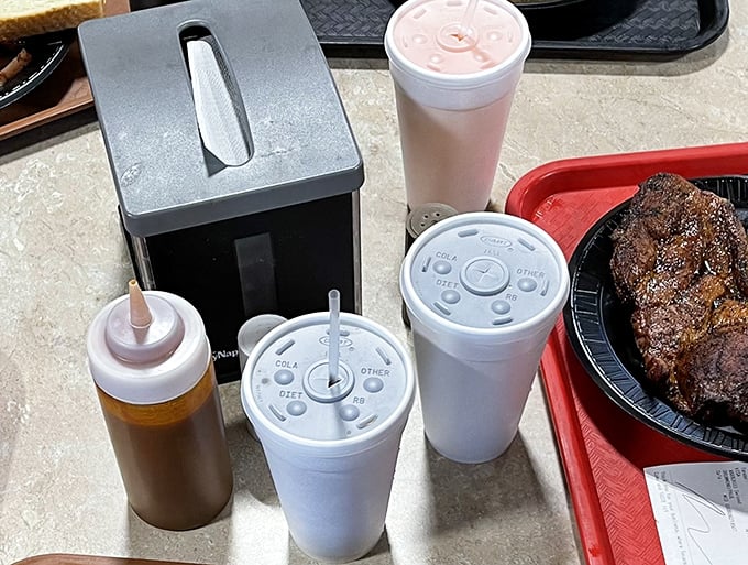 Sweet tea and sauce bottles – the supporting actors in the barbecue drama that unfolds daily at Baker Boys. That meat doesn't need much help, though.