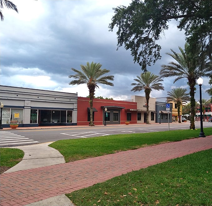 Colorful storefronts under Florida's dramatic skies create a downtown where shopping local isn't just a bumper sticker—it's actually enjoyable.