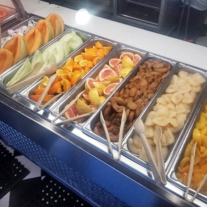 Fresh fruit trays offer sweet redemption between bites of bacon—Florida citrus practically glowing with sunshine.