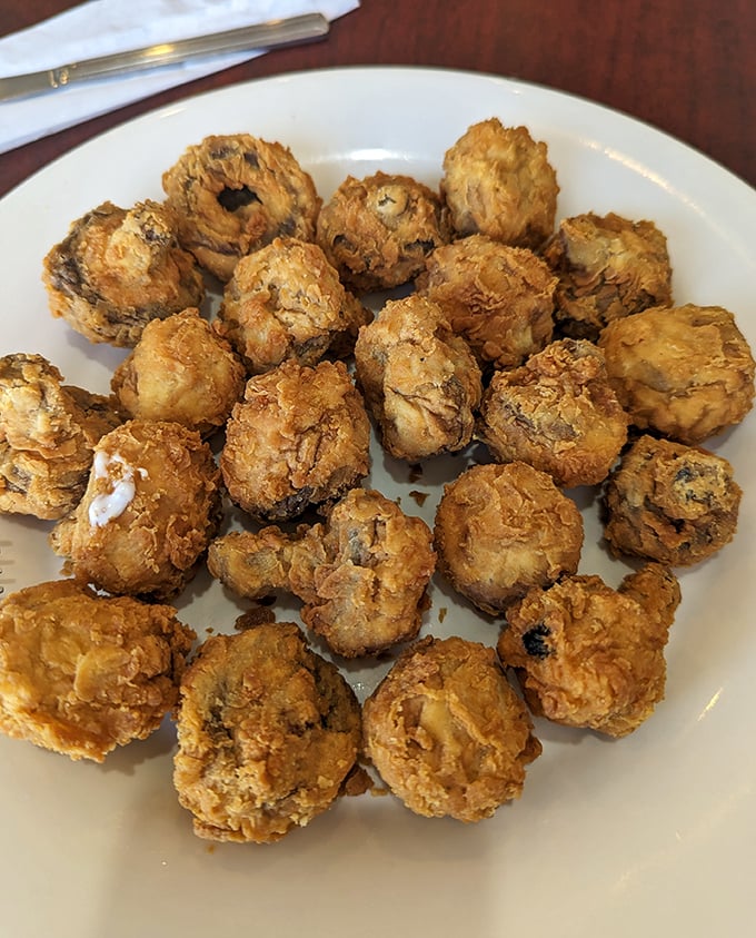 These aren't just fried mushrooms—they're little crispy universes of flavor that make you question why you ever ate vegetables any other way.