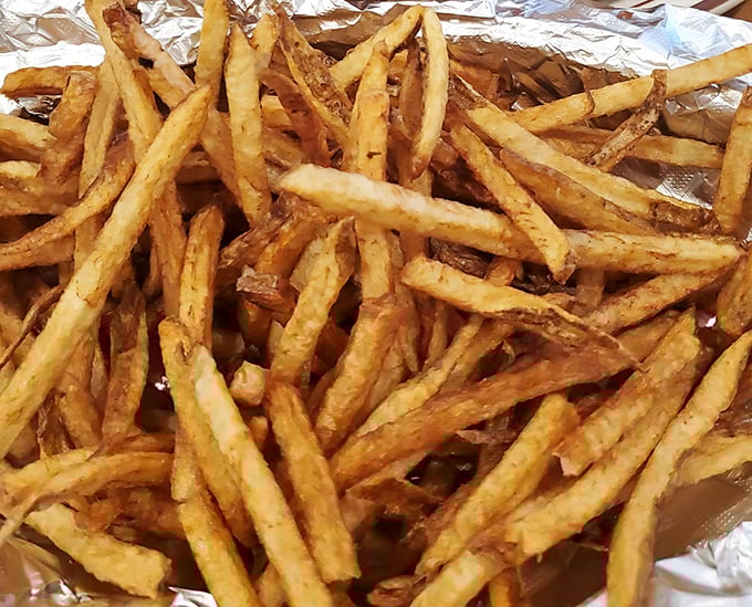 Golden, crispy fries that achieve that perfect balance between exterior crunch and fluffy interior – the supporting actor that steals every scene.