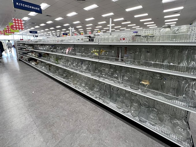 Glass act—shelves of potential dinner party upgrades that say "I have sophisticated taste" without saying "I paid full price."