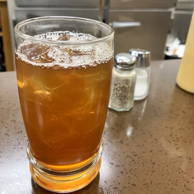 That iced tea isn't just a beverage—it's the perfect supporting actor in the burger drama about to unfold on your taste buds.