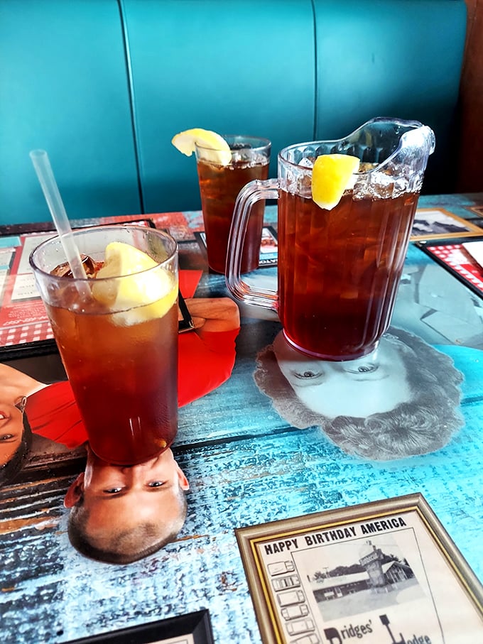Sweet tea served in proper pitchers with lemon wedges—because in North Carolina, barbecue without sweet tea is like a day without sunshine.