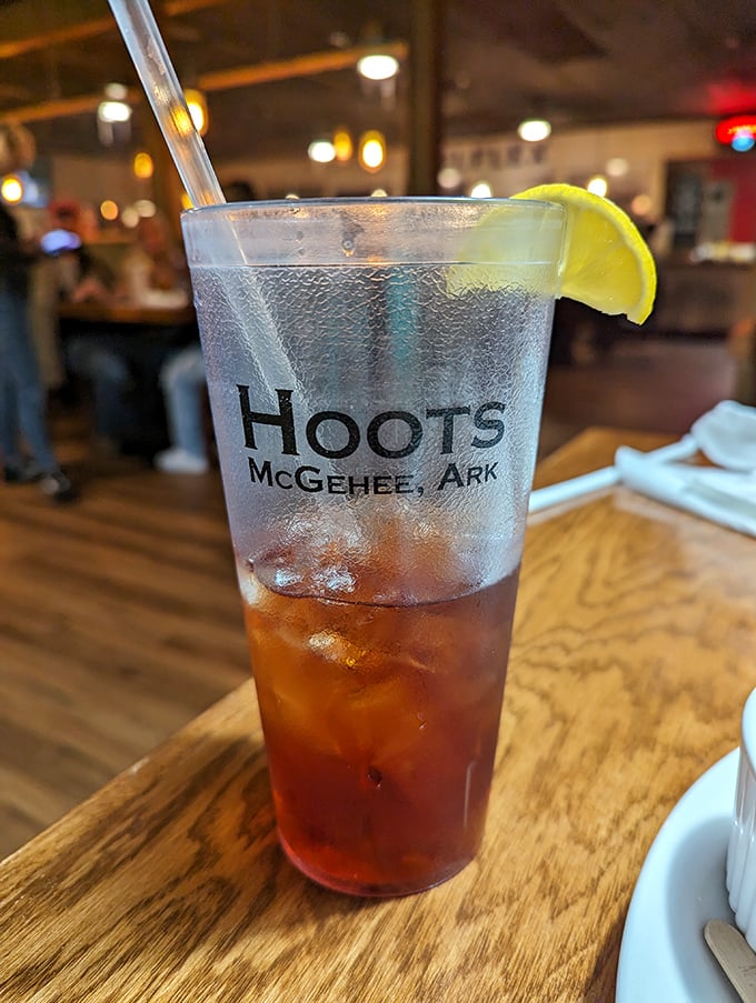 Even the iced tea gets the royal treatment at Hoots. That branded glass with its slice of lime is Arkansas hospitality in liquid form.