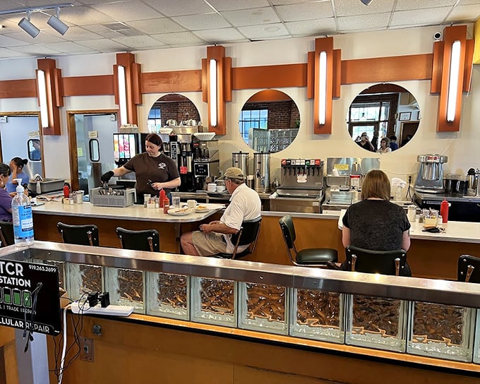 The counter—where solo diners find community, coffee cups are never empty, and the staff choreographs the breakfast ballet with practiced precision.