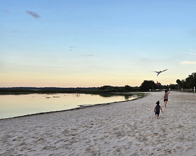Sunset magic unfolds as children chase dreams along the shoreline. This isn't just sand and water—it's childhood bottled in golden hour light.