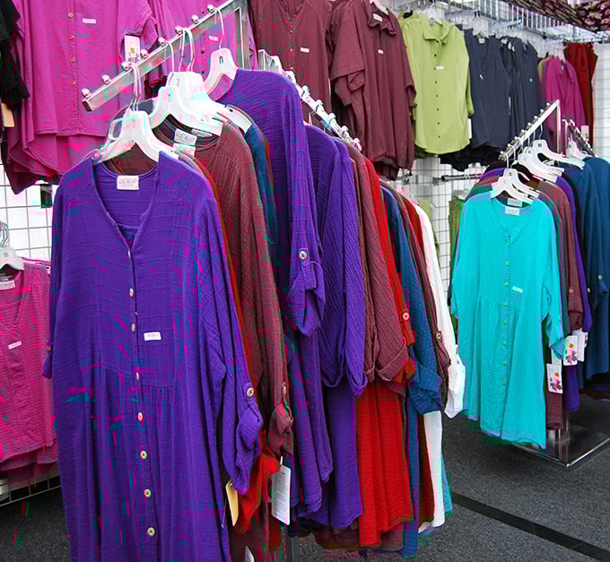 A rainbow of women's fashion hangs in perfect formation, with breathable fabrics in desert-friendly hues that practically whisper "Arizona casual."