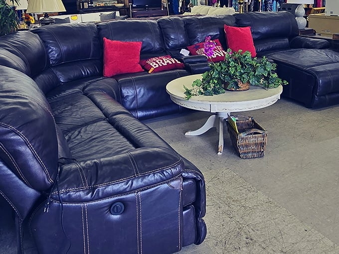 This sectional has seen some living. With those red pillows, it's ready for its second act in someone's man cave or family room.