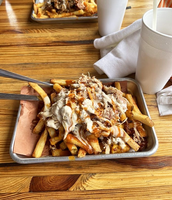 These loaded fries aren't just a side dish—they've been promoted to main character status with pulled pork and sauce playing supporting roles. 