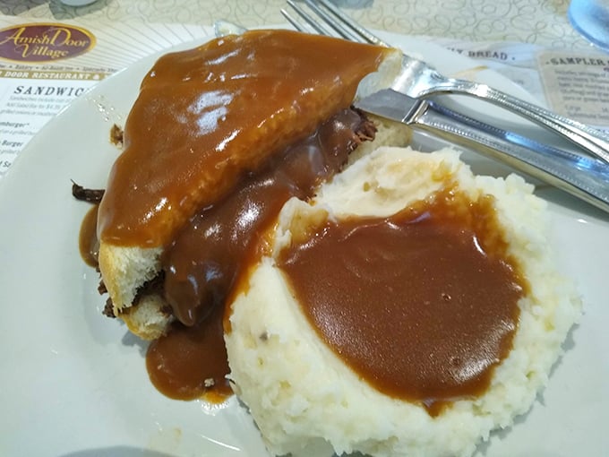 Mashed potatoes and gravy with roast beef—a plate that whispers "take a nap after this" in the most seductive way possible.