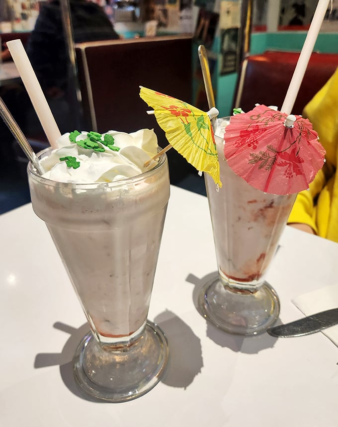 These milkshakes come dressed for the party with paper umbrellas – because happiness needs proper accessories.