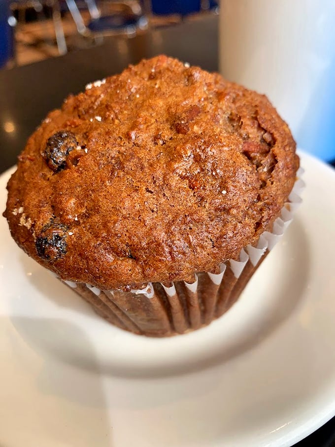 This muffin isn't just baked – it's been loved into existence, with a craggy top that promises hidden treasures within.