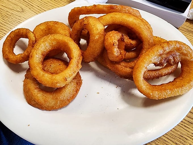 These onion rings aren't just fried—they're golden halos of crispiness that make you believe in deep-fried divinity.