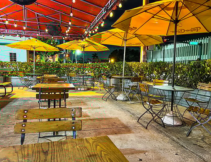 As night falls, the string lights transform this humble outdoor space into Miami's most charming dining room under the stars.