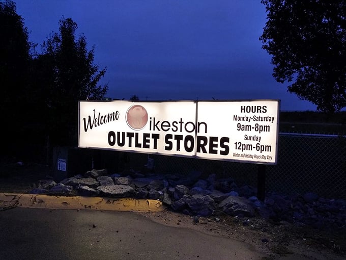 The welcome sign glows like a lighthouse guiding weary shoppers to their promised land of savings.