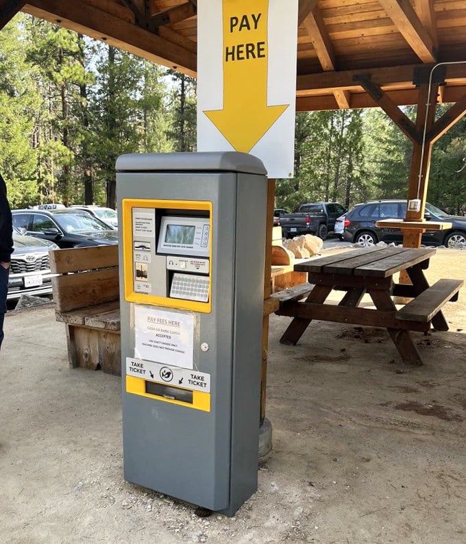 The price of paradise is surprisingly reasonable. This payment station collects your entrance fee while picnic tables await your lunch spread.