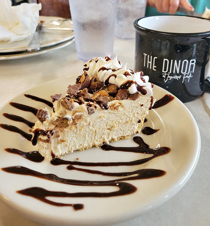 This slice of peanut butter pie might be worth driving across state lines for—creamy, decadent, and drizzled with chocolate.